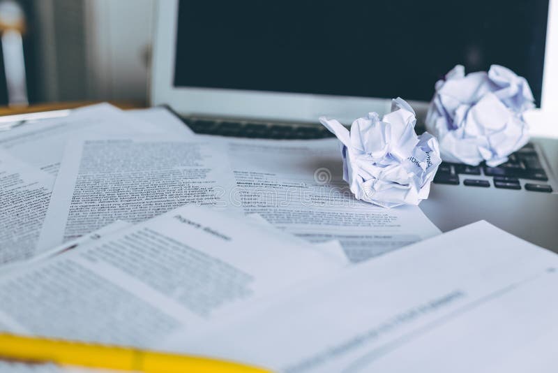 Working Mess with Crumpled Papers, Laptop and Different Papers on ...