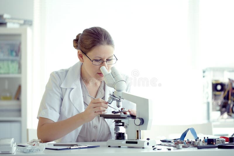 Working with microscope stock image. Image of repair - 77353785