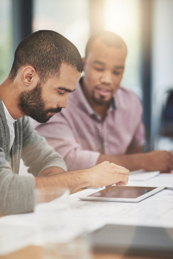 Working on a New Project. Two Young Businessmen in a Meeting. Stock ...