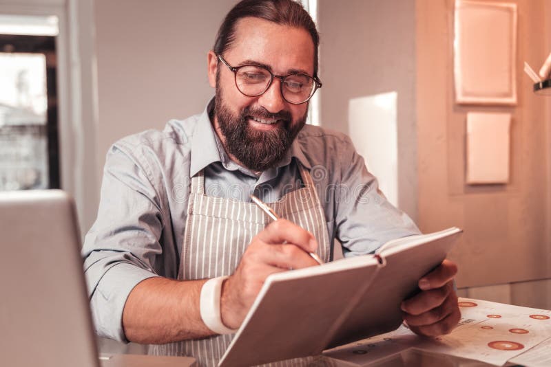 Waiter Making Important Notes in His Notebook Stock Photo - Image of ...