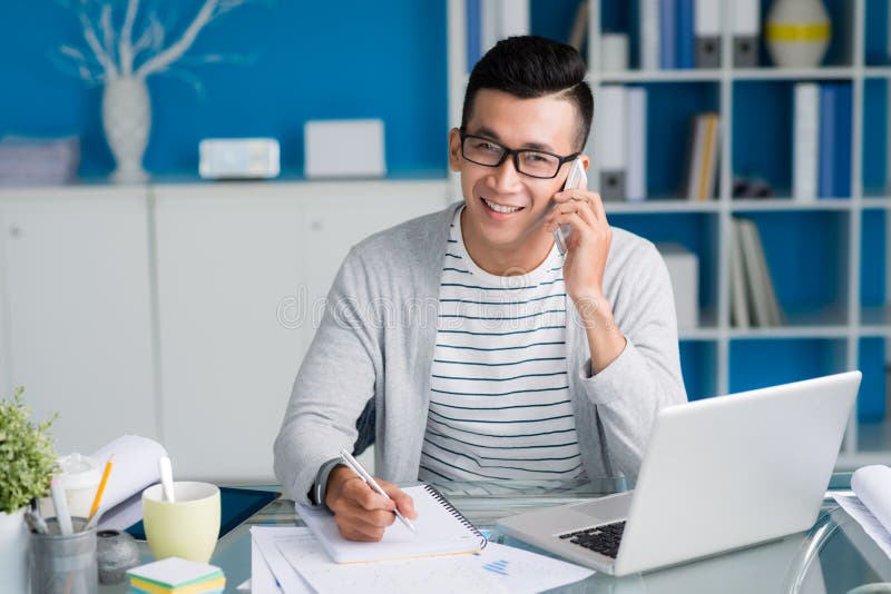 Working at office desk stock image. Image of casual, laptop - 58549525