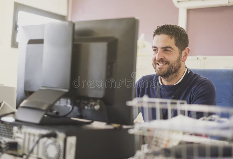 Working Office Worker Smiling at Pc Stock Photo - Image of people ...