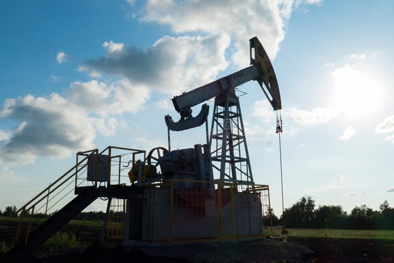 Working Oil Pump on the Ground among the Green Fields Stock Image ...