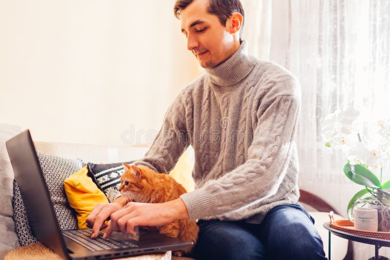 Working Online from Home with Pet Using Computer. Man Typing on Laptop ...