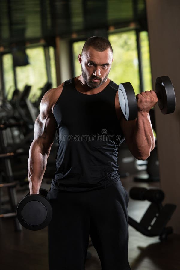Working Out Biceps with Dumbbells Stock Image - Image of torso ...