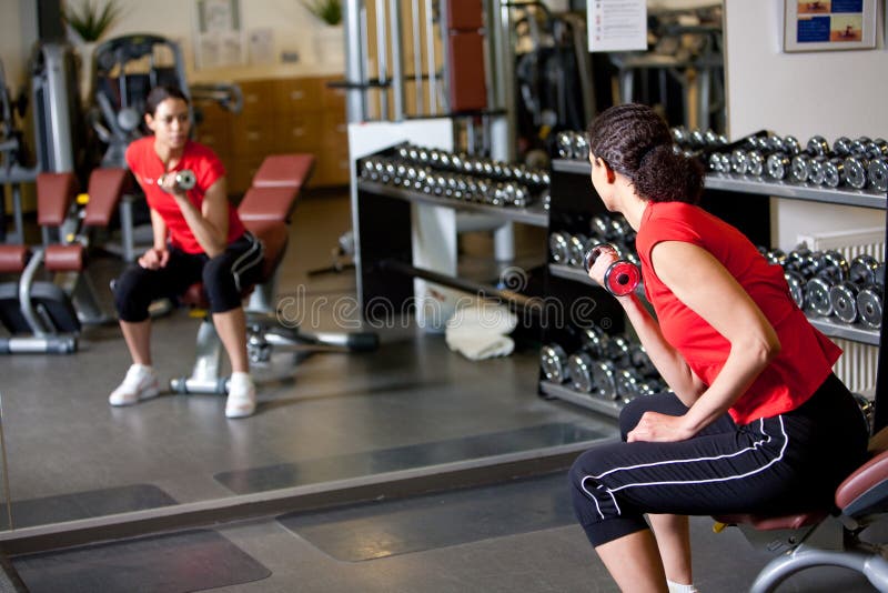 Working out in the gym stock photo. Image of latino, mirror - 9735056