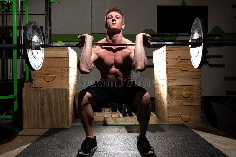 Working Out Hard in Dramatic Light Stock Image - Image of muscular ...