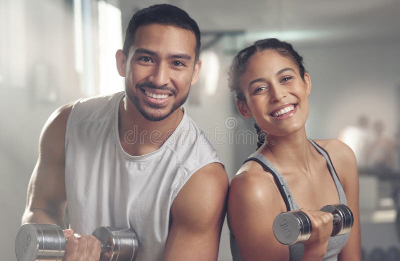 Working Out Makes Us Happy. Two Young Athletes Holding Dumbbells. Stock ...