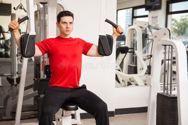 Working Out on Pec Deck Machine Stock Photo - Image of exercising ...