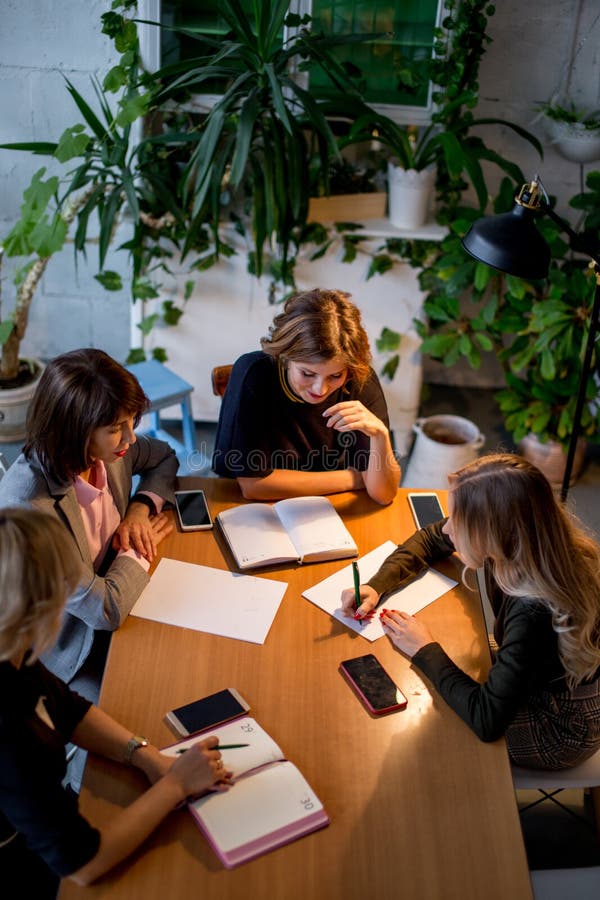 Working Overtime Concept. Group of Female Business Team Working Late at ... Working Overtime Concept. Group of Female Business Team Working Late at ...