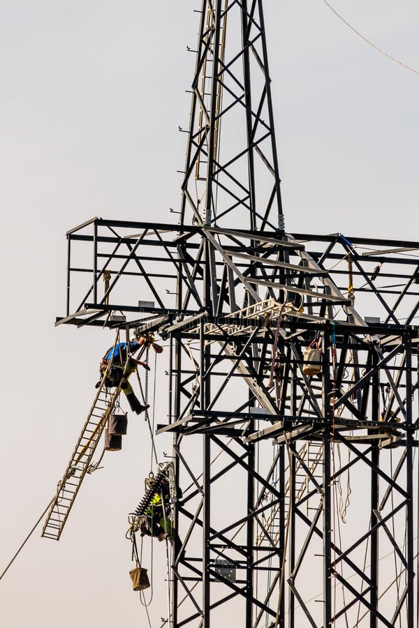 Working on a power poles stock photo. Image of cable - 53350546