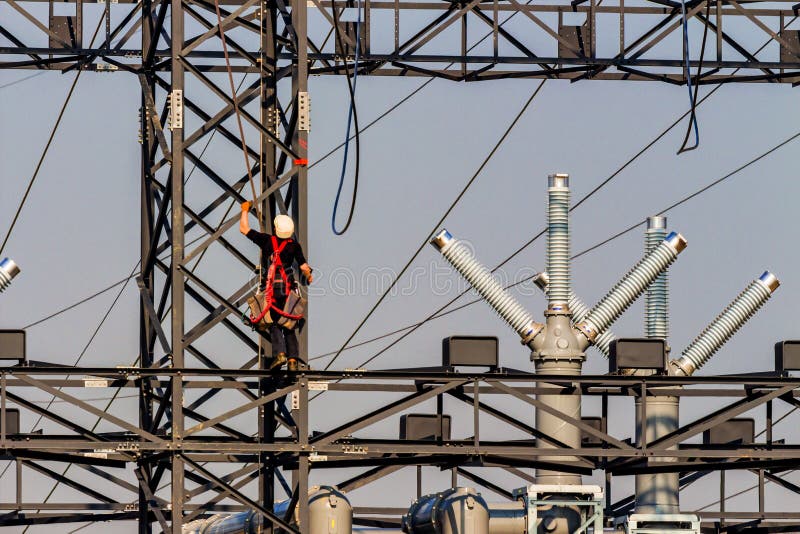 Working on a power poles stock photo. Image of energy - 53501384