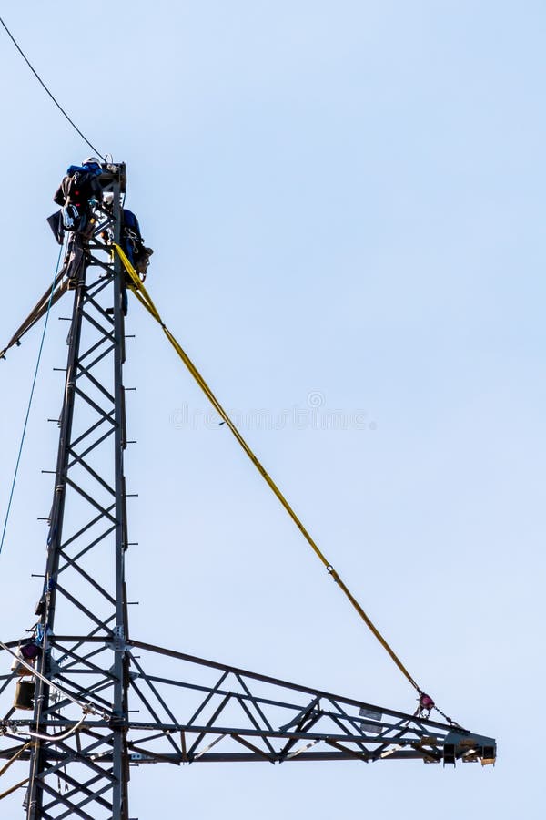Working on a power poles stock photo. Image of establishment - 53549534