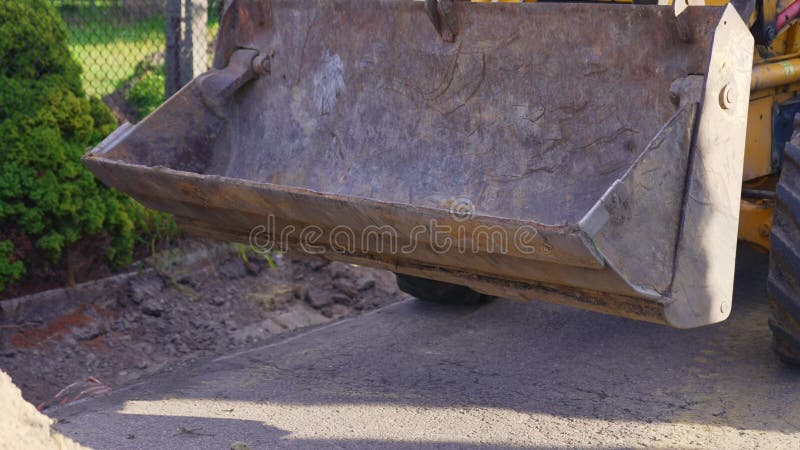 Working Process at a Construction Site. Tractor Bucket Close Up Stock ...