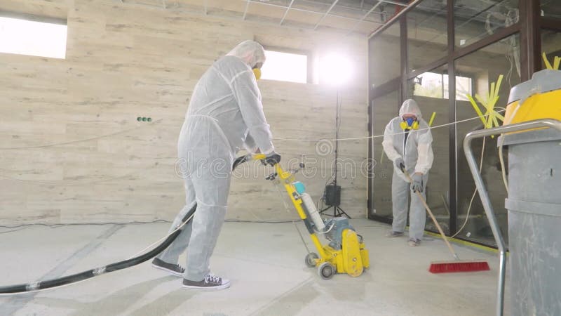 Grinding a Concrete Floor with a Grinder. Concrete Floor Processing ...