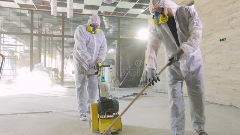 Grinding a Concrete Floor with a Grinder. Concrete Floor Processing ...