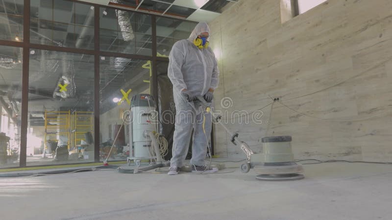 Grinding a Concrete Floor with a Grinder. Concrete Floor Processing ...