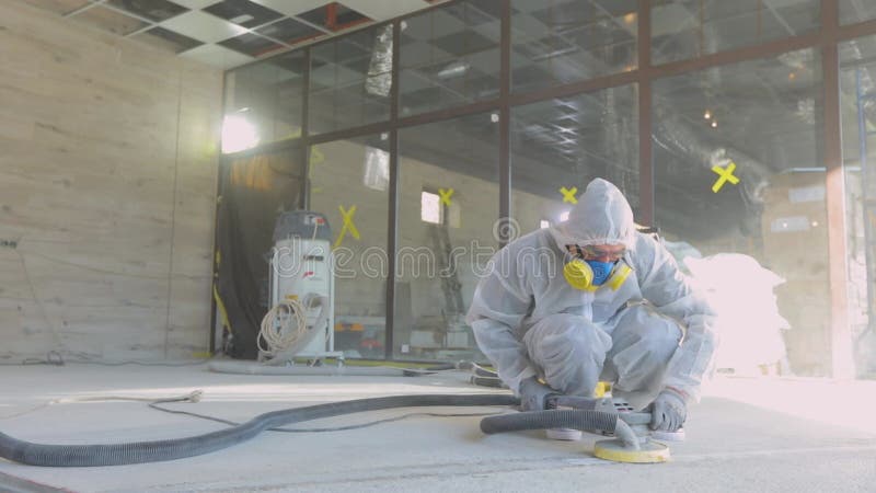 Grinding a Concrete Floor with a Grinder. Builder Works Concrete Floor ...