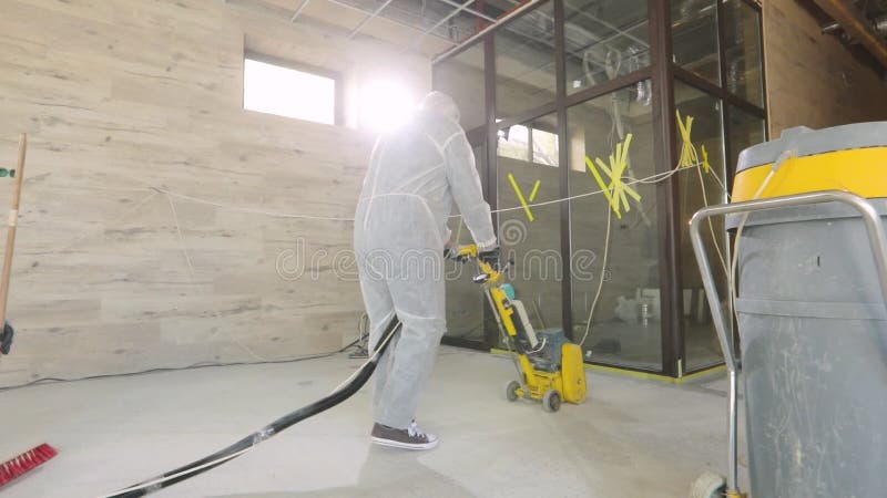 Grinding a Concrete Floor with a Grinder. Concrete Floor Processing ...