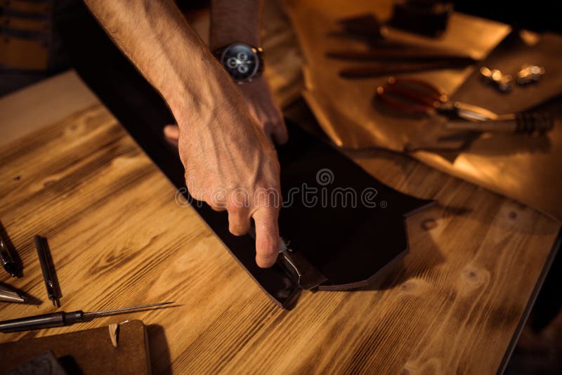 Working Process of the Leather Belt in the Leather Workshop. Man ...