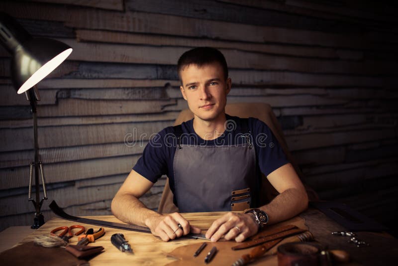 Working Process of the Leather Belt in the Leather Workshop. Man ...