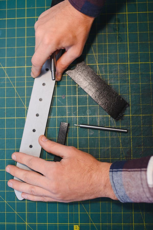 Working Process of the Leather Belt in the Leather Workshop. Man ...