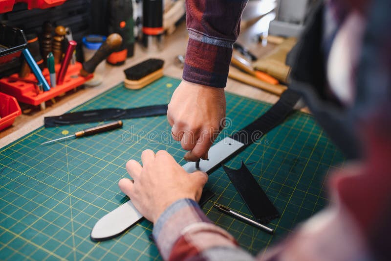 Working Process of the Leather Belt in the Leather Workshop. Man ...