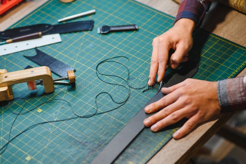 Working Process of the Leather Belt in the Leather Workshop. Man ...