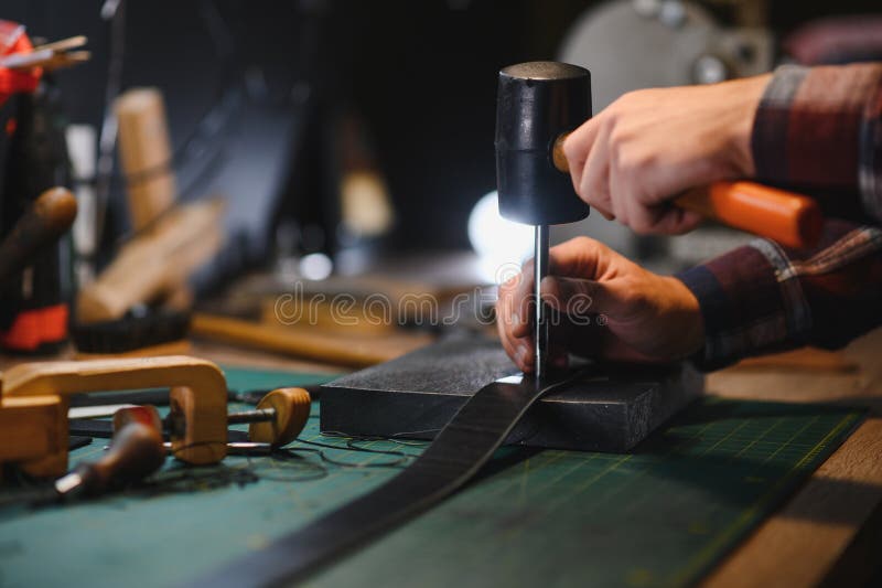 Working Process of the Leather Belt in the Leather Workshop. Man ...
