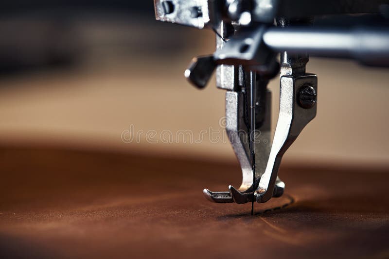 Working Process of Leather Craftsman. Tanner or Skinner Sews Leather on ...