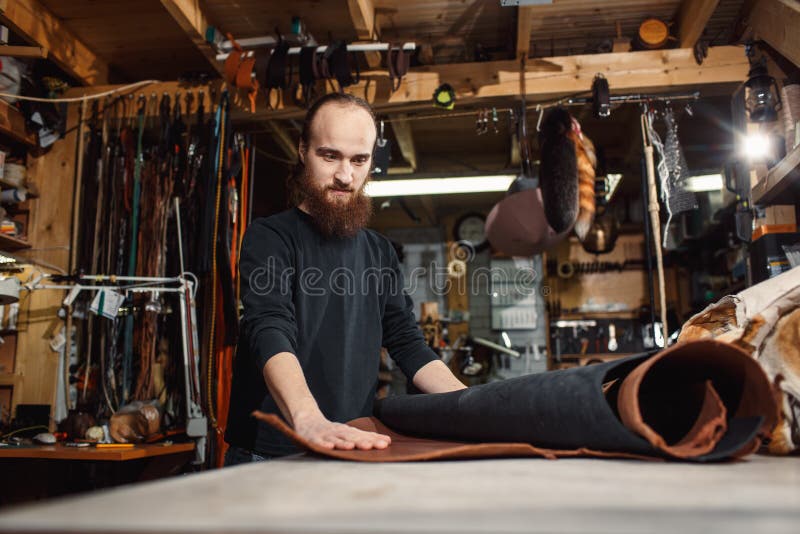 Working Process in the Leather Workshop. Tanner in Old Tannery. Stock ...