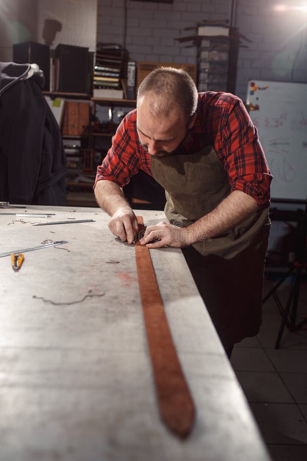 Working Process in the Leather Workshop. Tanner in Old Tannery. Stock ...