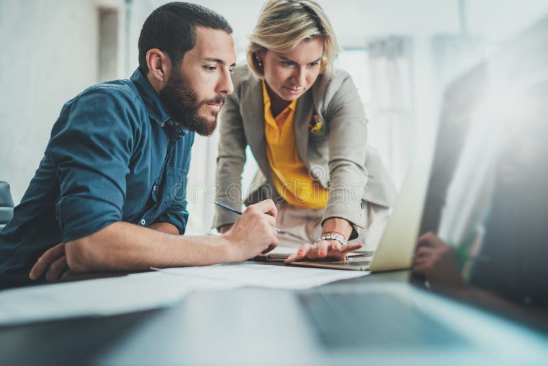 Working Process Photo.Two Young Coworkers Working Together at Modern ...