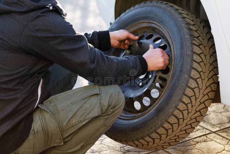 Working Process of Removing the Wheel from the Car Stock Photo - Image ...