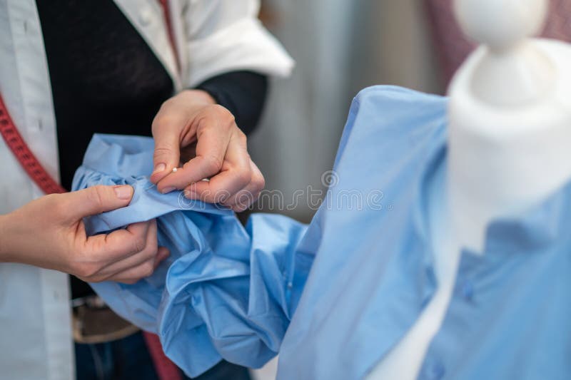 Hands of Tailor with Pin Touching Sleeve of Blouse Stock Photo - Image ...