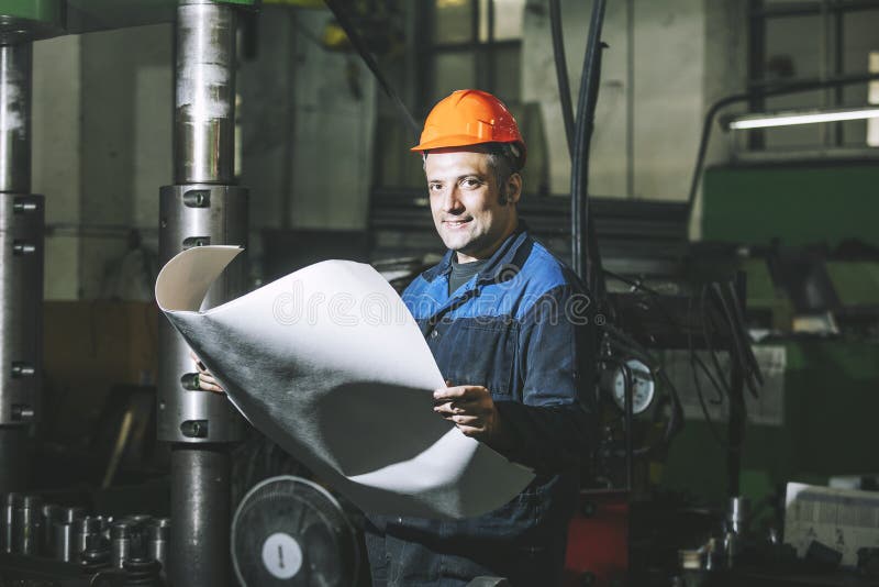 Working in Production Against a Background of Machines from the Stock ...