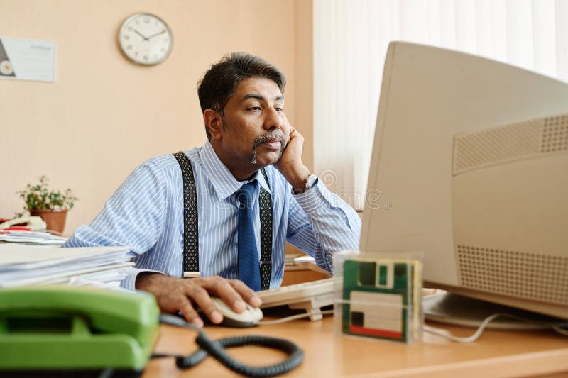 Working Professional Using Computer in Office Setting Stock Photo ...