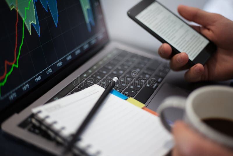 Working Project on Laptop with Coffee and Smartphone in the Hands Stock ...