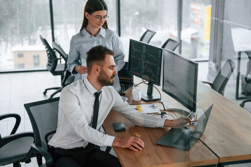 Working on a Project Together. Two Employees are in the Office. Stock ...