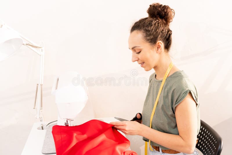 Working with red textile stock image. Image of production - 143435781
