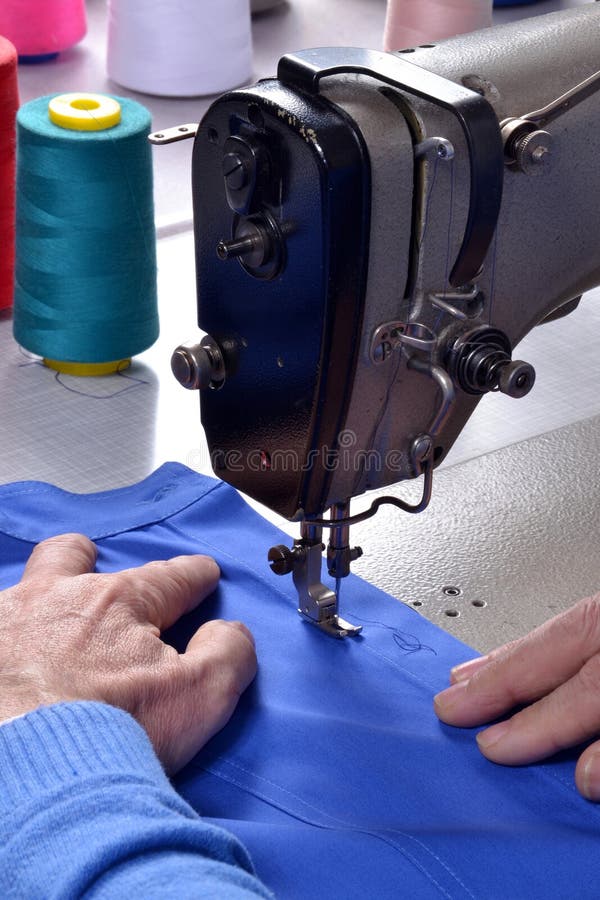 Working on sewing machine. stock image. Image of cotton - 38719855