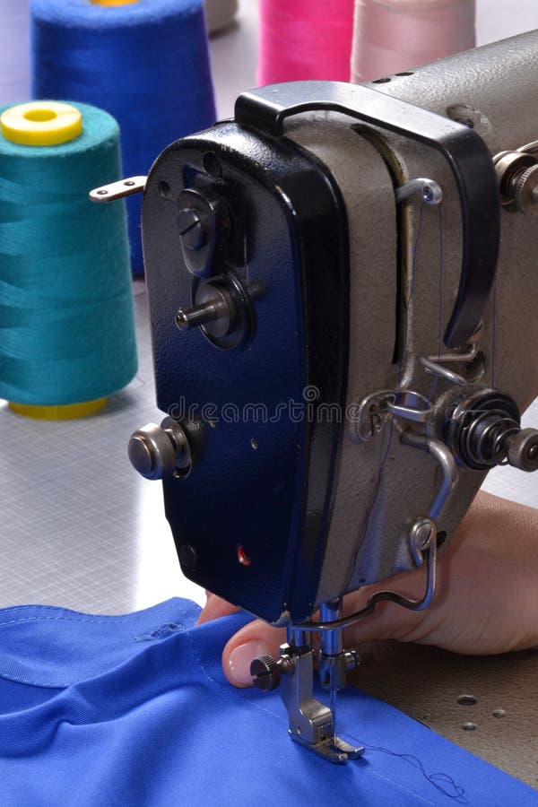 Working on sewing machine. stock photo. Image of industry - 38720600