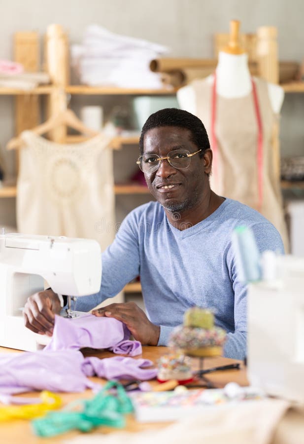 Working in Sewing Workshop - Male Tailor Working at Sewing Machine ...