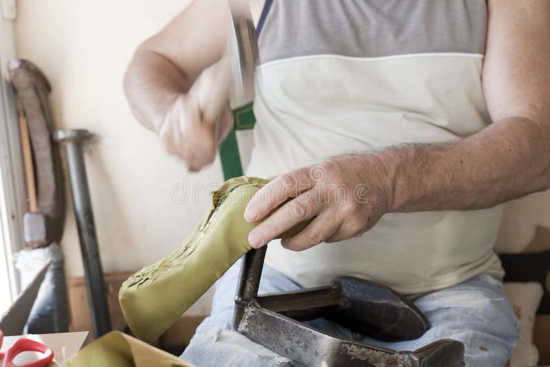 Working in the shoe shop stock image. Image of manufacture - 22630027