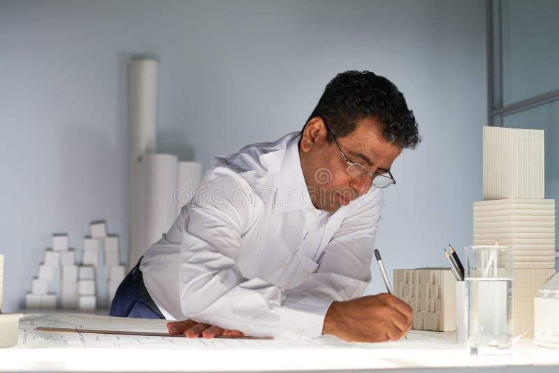 Engineer drawing sketch stock image. Image of serious - 77604621