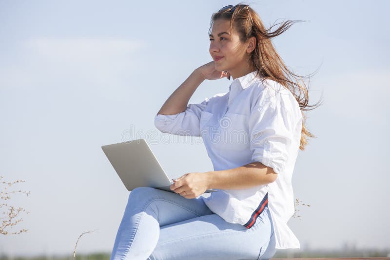 Working on Something with a Laptop in a Public Park Stock Image - Image ...