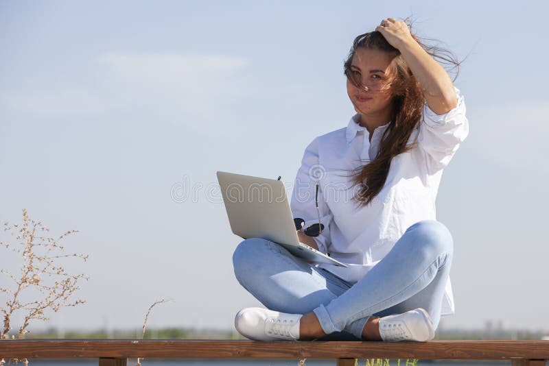 Working on Something with a Laptop in a Public Park Stock Image - Image ...