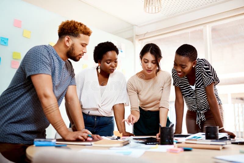 Working on Something New and Different for Their Customers. a Group of ...