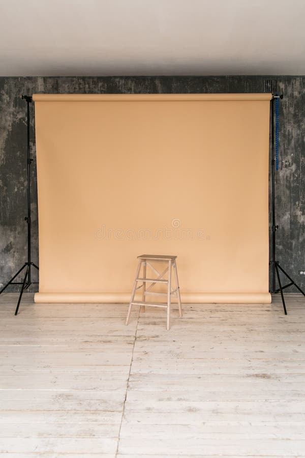 The Working Space of the Photo Studio with a Beige Paper Background and ...