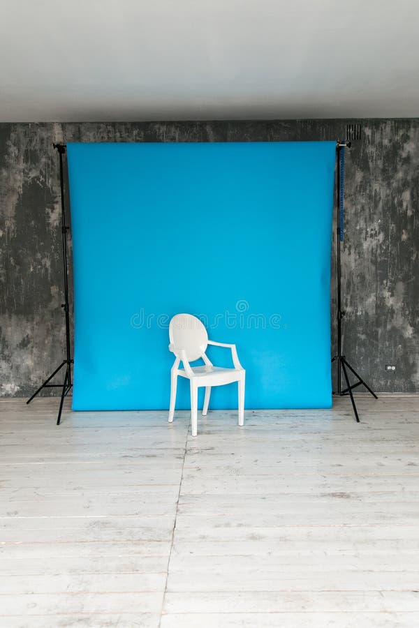 The Working Space of the Photo Studio with a Blue Paper Background and ...